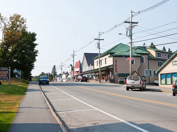 The peaceful streets of Rangeley invite leisurely strolls past local businesses where your dollar stretches further than your big-city memories.