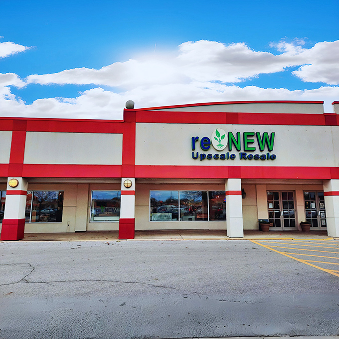 Blue skies and great buys &ndash; Renew's red and white building stands ready for your next thrifting adventure.