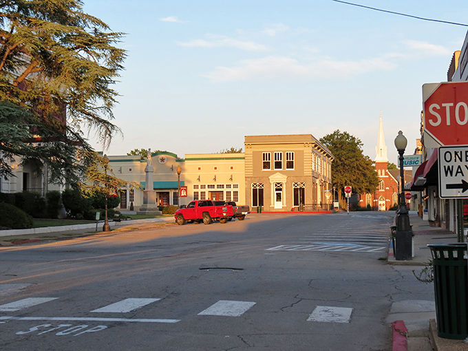 Sunrise in Searcy paints the historic downtown in golden light. Where else can you find this perfect blend of small-town serenity and architectural character without breaking the bank?