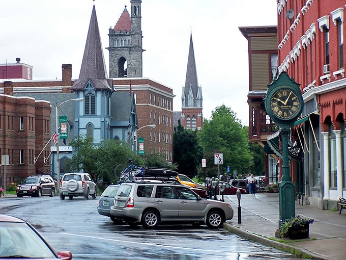 Rain-slicked streets reflect St. Johnsbury's magnificent church spires. Even on gray days, this walkable downtown maintains its postcard-perfect New England charm.