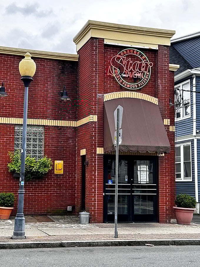 Star Tavern's brick exterior doesn't need to shout&mdash;the neon sign says it all. Orange's pizza landmark has been drawing crowds for generations.