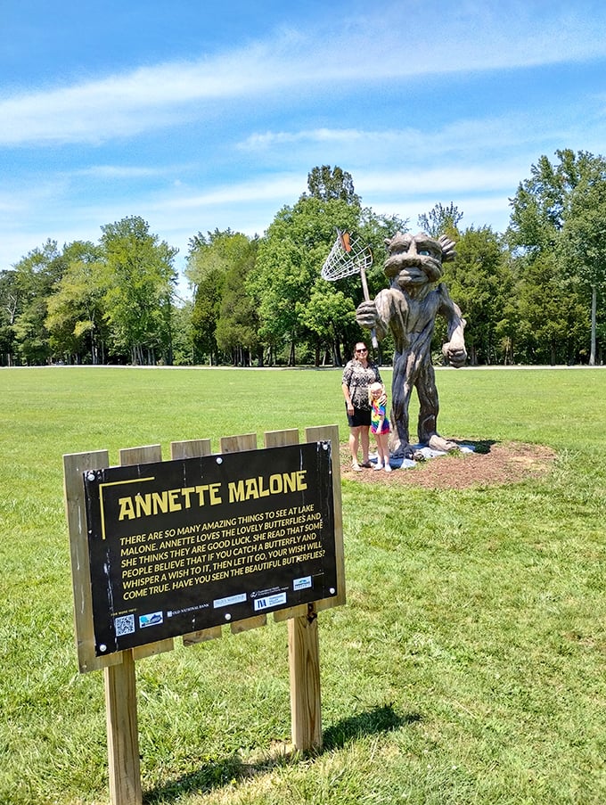 Annette Malone stands ready with her butterfly net, proving that even mythical forest creatures appreciate the simple joy of chasing butterflies on a summer day.
