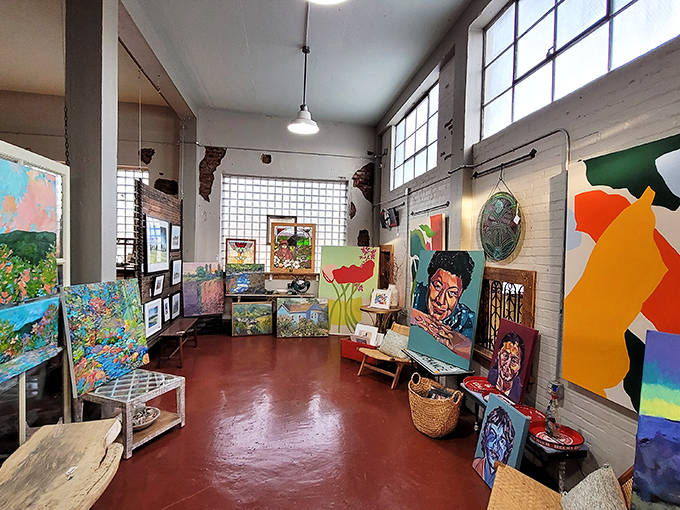 The art gallery corner offers a colorful respite from industrial salvage, proving that beauty finds many forms under one warehouse roof.
