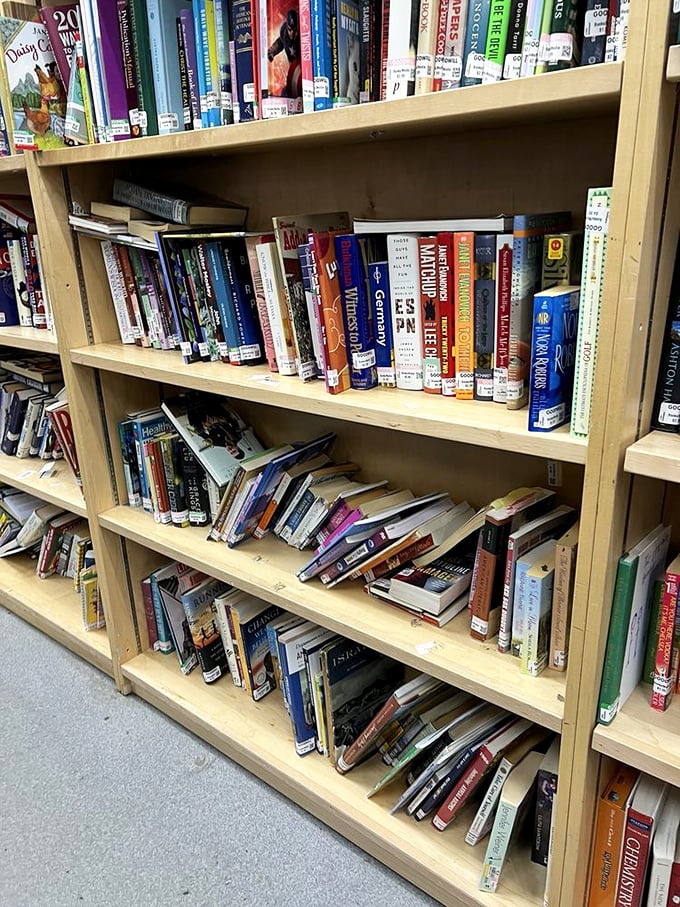 A bibliophile's dream where literary treasures await new homes. These shelves hold everything from forgotten bestsellers to that cookbook your grandmother swore by.