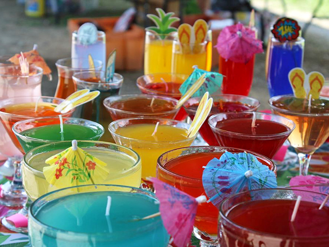 These vibrant handcrafted candles aren't just decorative&mdash;they're tiny cocktail parties waiting to happen in your living room!