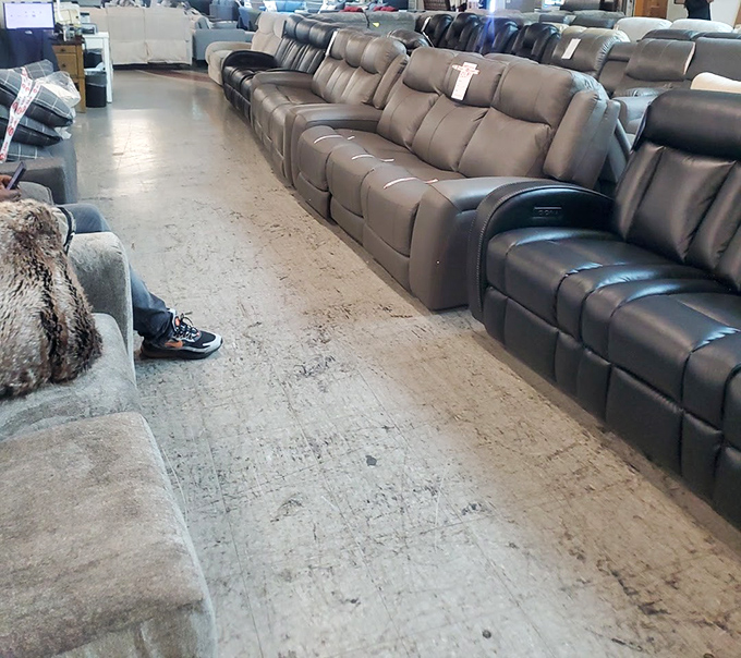 Rows of plush recliners await test-sitters, arranged like a leather and fabric army ready to comfort weary shoppers.