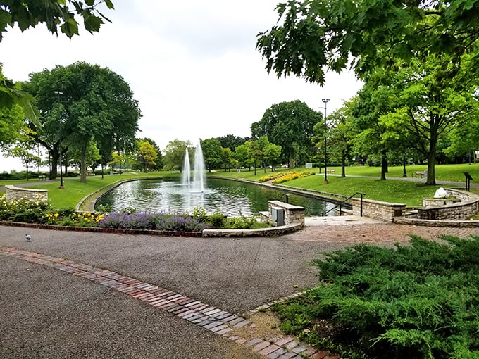 Dawes Park's fountain creates a moment of Parisian tranquility, the kind of place where philosophers might ponder life's questions between sips of espresso.