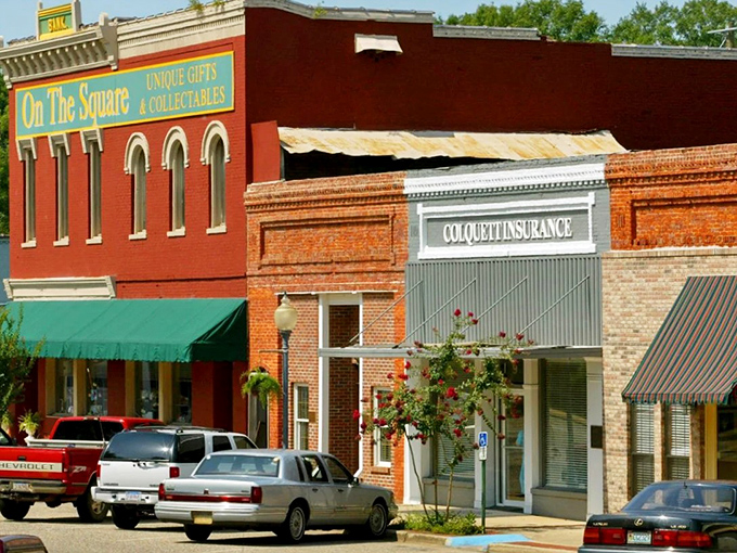 Colorful storefronts on the square offer a palette of small-town charm that feels like stepping into a watercolor painting of simpler times.