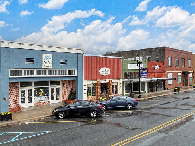 Downtown storefronts maintain their mid-century charm, where blue awnings and brick facades tell stories of businesses that have weathered changing times.