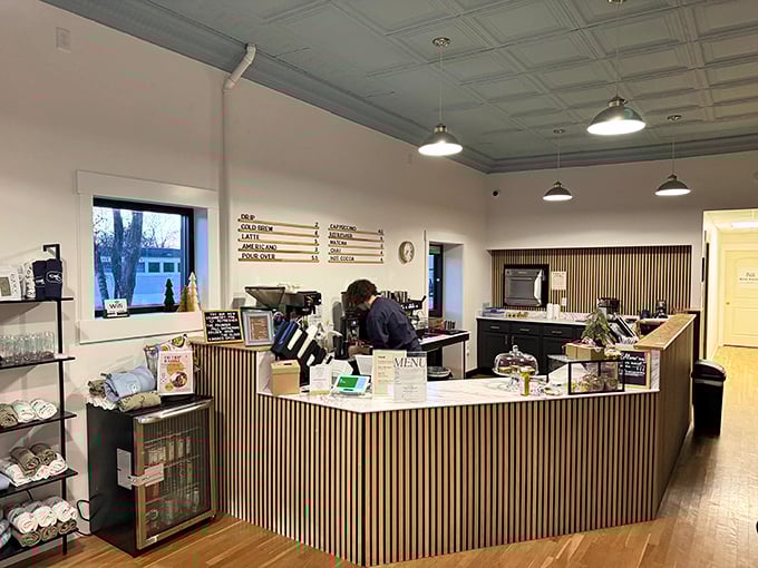 At Fellows Coffee, the wooden counter and bright interior invite lingering conversations over house-blend coffee that tastes like morning optimism in a cup.