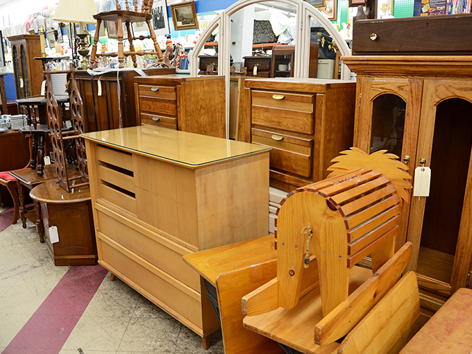 Mid-century meets Victorian in this furniture display. That wooden mailbox might be the most unnecessary item you'll ever convince yourself you absolutely need.