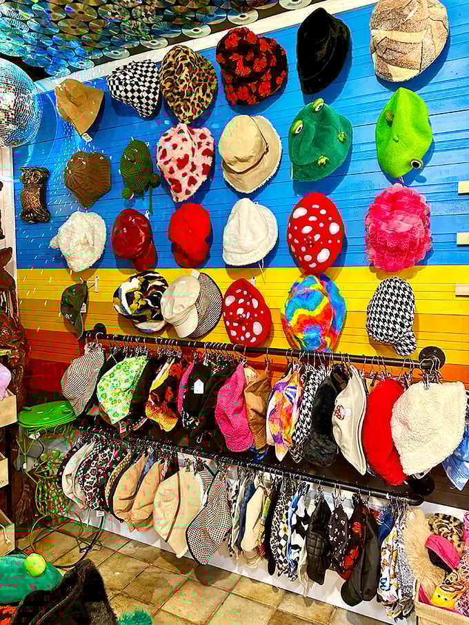 Hat heaven! From frog-green novelties to leopard prints, this wall of headwear is where personal style meets wearable history.