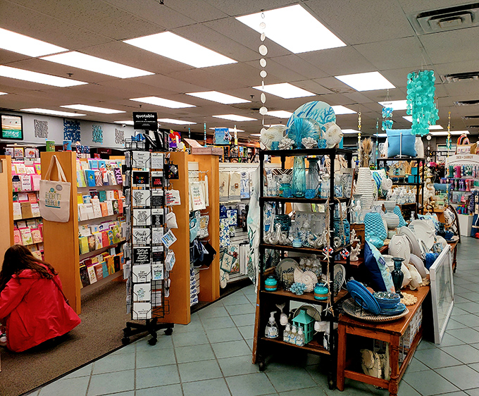 A treasure trove of coastal-themed gifts mingles with books, proving that Browseabout understands beach vacations need both literary and decorative souvenirs.