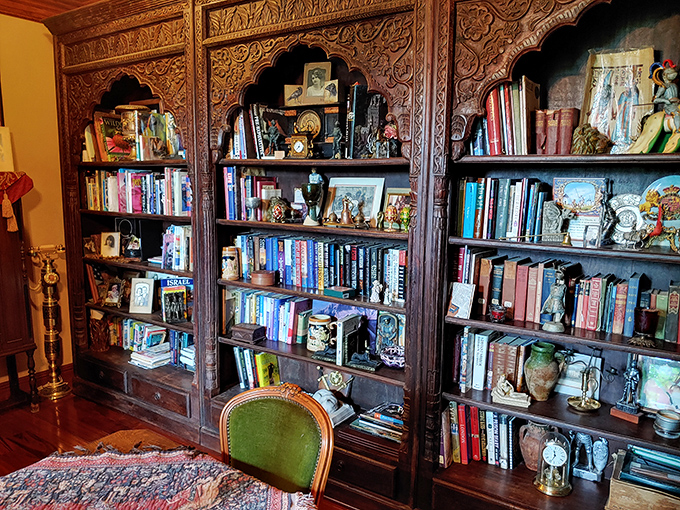 Floor-to-ceiling carved bookshelves prove that castle living and cozy reading nooks aren't mutually exclusive concepts.