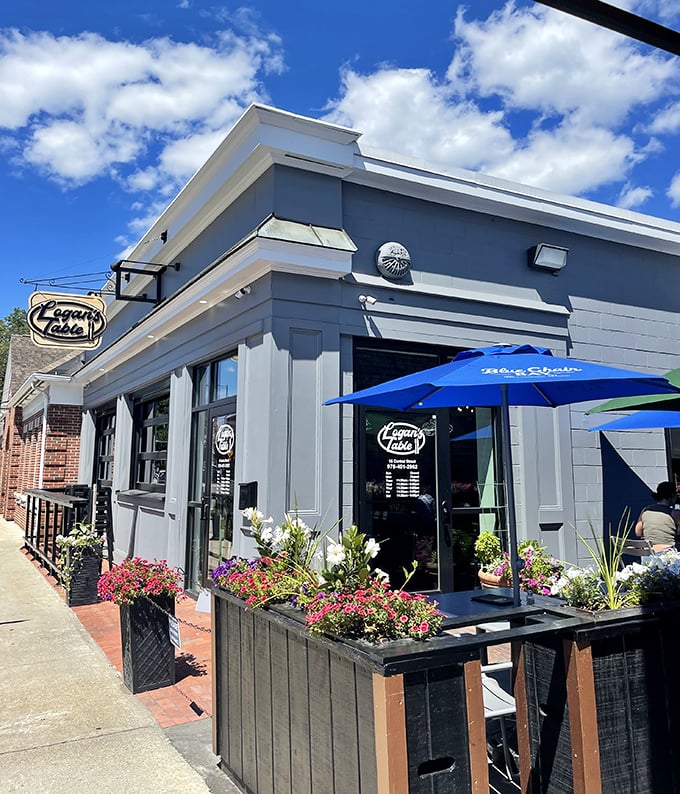 Legacy Café's cheerful blue umbrella and flower boxes invite passersby to stop for a coffee and pastry—the universal language of "come sit awhile."