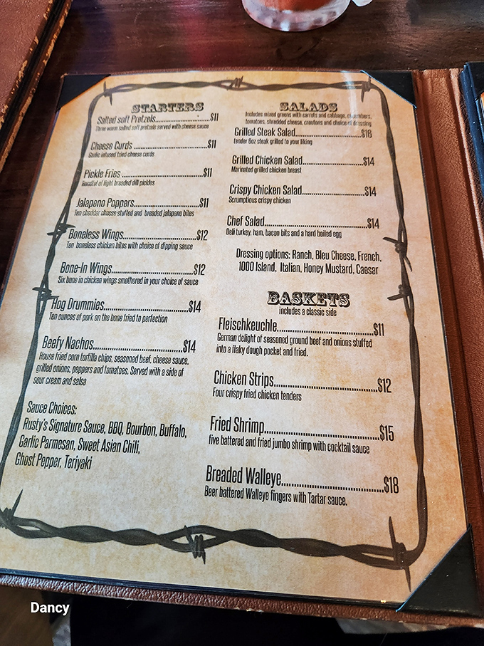 A menu bordered with barbed wire&mdash;the perfect North Dakota way of saying "these flavors are worth getting fenced in for."