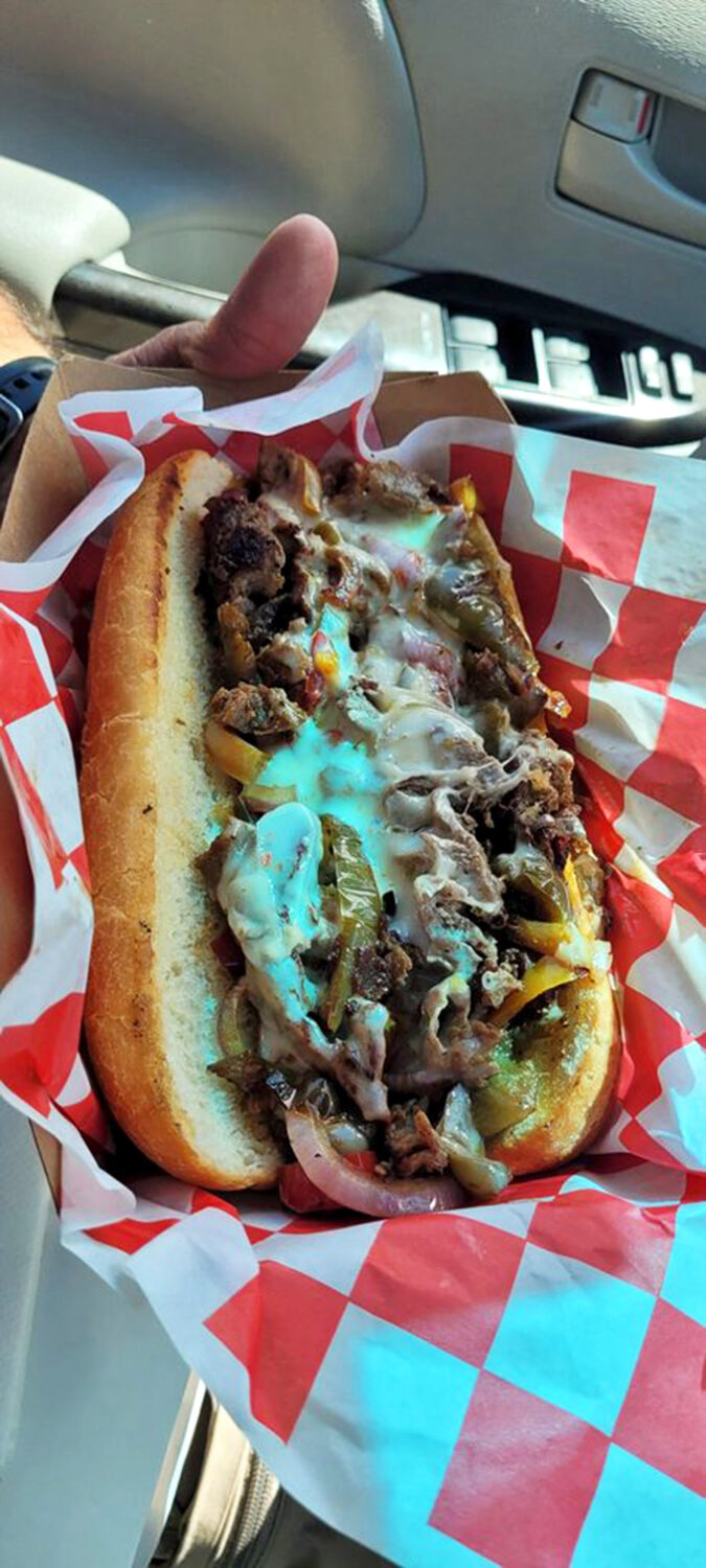 This isn't just a Philly cheesesteak; it's a masterclass in melty perfection. The kind of sandwich that makes you consider moving to Baker permanently.