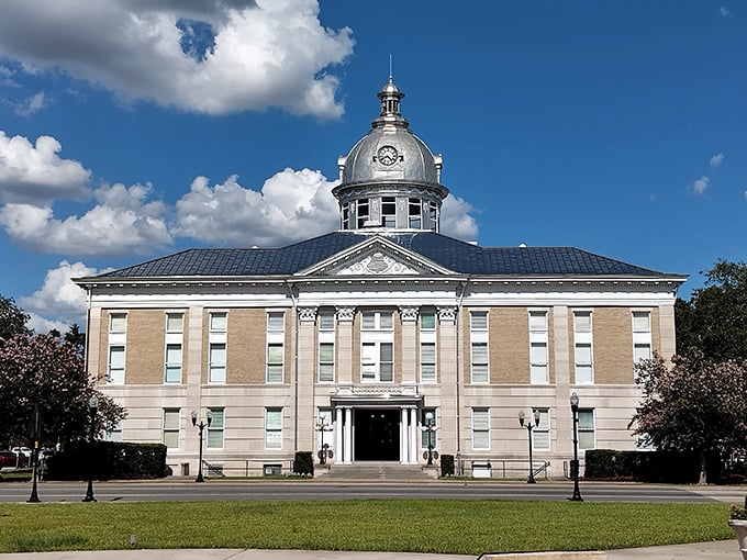 The magnificent Polk County Historic Courthouse stands as Bartow's crown jewel, its silver dome gleaming like a beacon of small-town grandeur.
