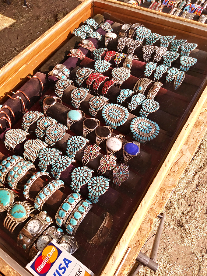 Turquoise and silver cluster designs glint in the sunlight, each piece a wearable masterpiece of Southwestern artistry.