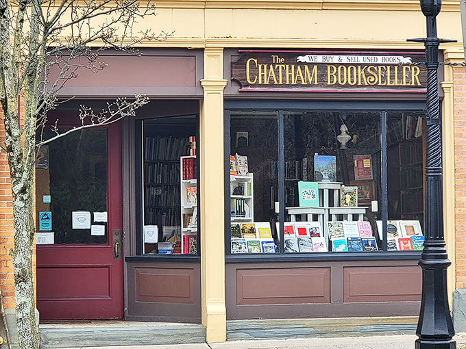 The Chatham Bookseller's window display beckons bibliophiles with the promise of literary treasures and that irreplaceable scent of well-loved books.