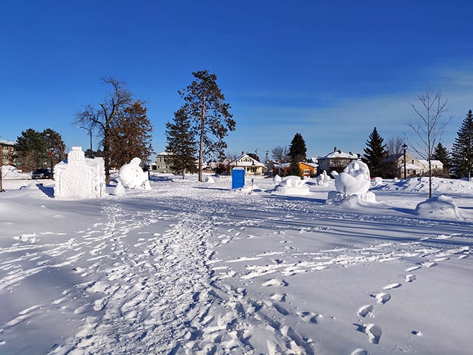 Winter transforms Whiteside Park into a playground of snow sculptures. Local artists turn frozen water into temporary masterpieces that glisten under Minnesota's blue skies.