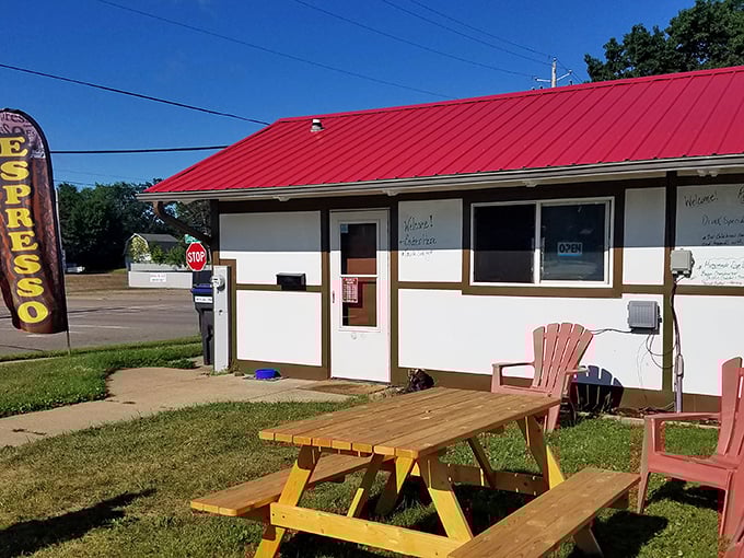 This unassuming espresso shack with its cheerful picnic table might just serve the best coffee break you'll have all week. Sometimes paradise comes with a red roof.