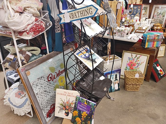 A bibliophile's corner where gardening wisdom meets vintage welcome signs. One person's decluttered bookshelf becomes another's weekend reading list.