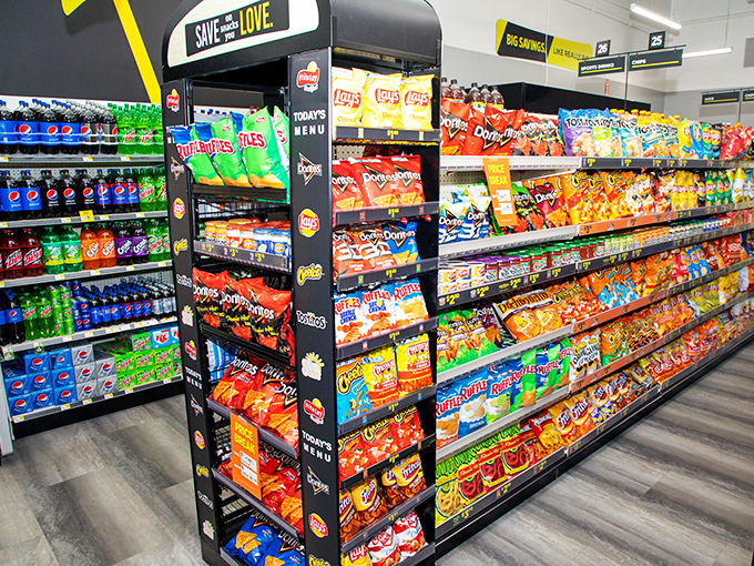 Snack heaven! The colorful array of chips and sodas creates a rainbow of temptation that would make any road trip or movie night complete.