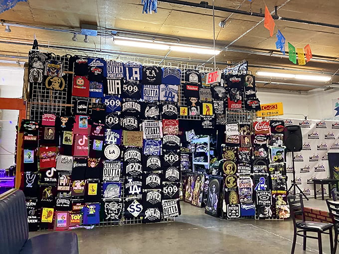 T-shirt heaven or graphic designer's playground? This wall of personality-on-cotton proves that sometimes the best souvenirs aren't things you see, but things you wear.