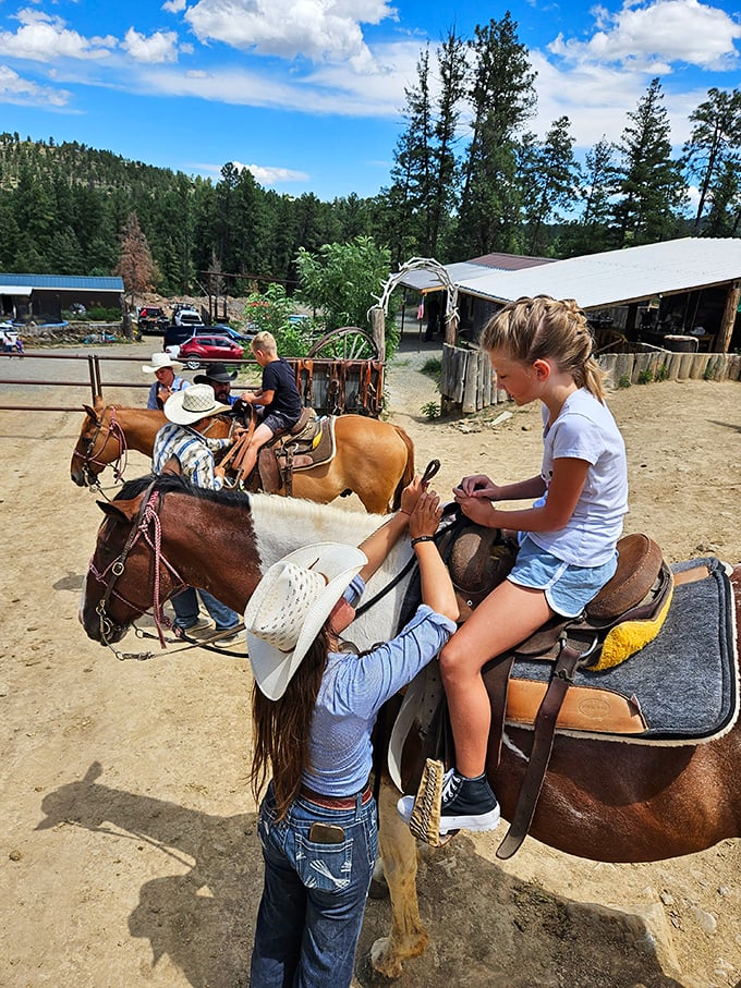 Nothing says "authentic mountain experience" quite like kids learning the ropes from patient instructors and even more patient horses.