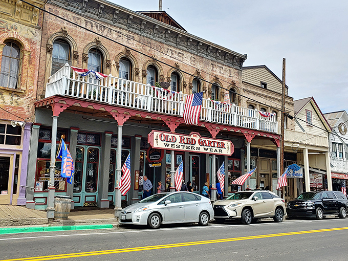 The Old Red Garter's fa&ccedil;ade tells stories of the Wild West, with American flags fluttering like colorful punctuation marks in the mountain breeze.