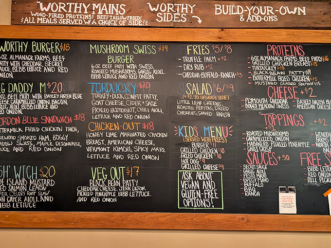 The chalkboard menu tells the whole delicious story: locally-sourced ingredients transformed into wood-fired masterpieces that would make any burger aficionado weak at the knees.