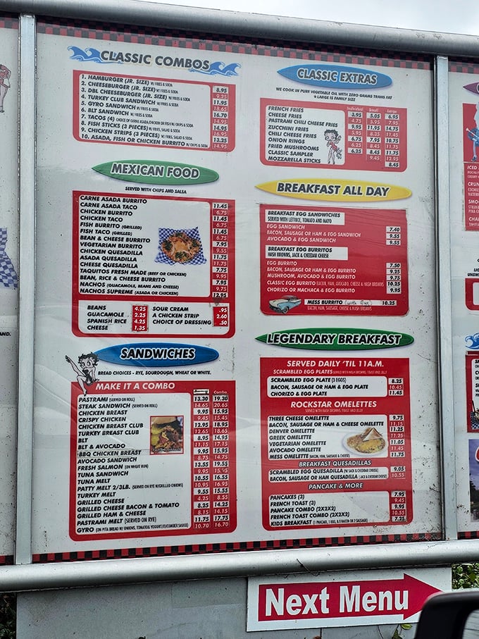 The menu board reads like a love letter to American comfort food—breakfast all day and pastrami that demands your immediate attention.