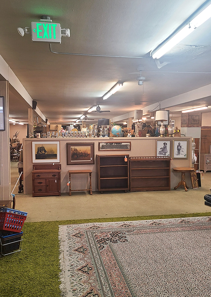 Even the EXIT sign seems reluctant to leave this wonderland of wooden furniture and maritime art, where vintage rugs create islands of pattern in a sea of possibility.