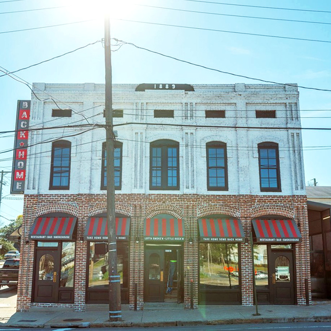 History meets hickory at Back Home BBQ, where that gorgeous 1883 building houses some seriously modern smoking skills. Those red awnings practically wink at you!