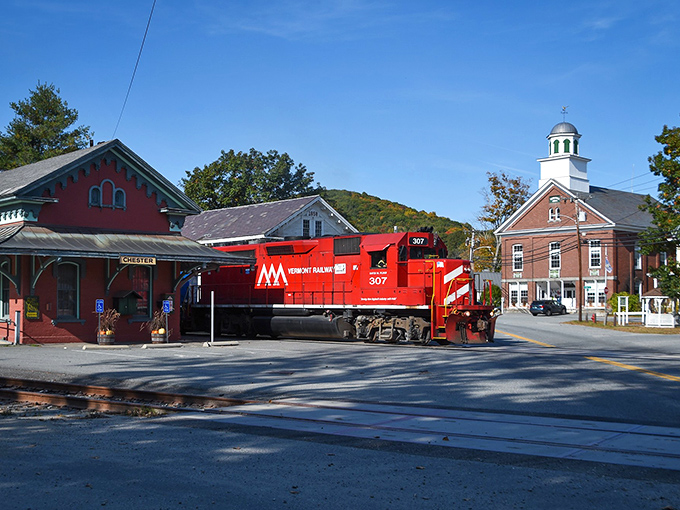 The red train against Chester's classic New England architecture creates a splash of color in this timeless village scene.