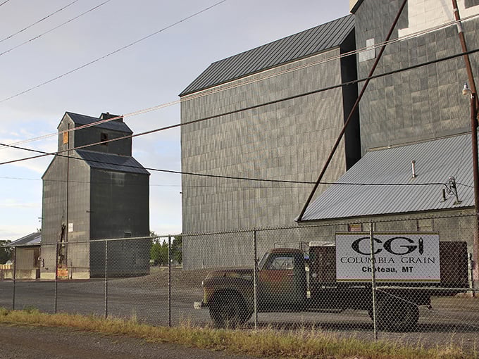 Choteau's grain elevators stand like prairie sentinels, monuments to Montana's agricultural heart that feeds the nation.