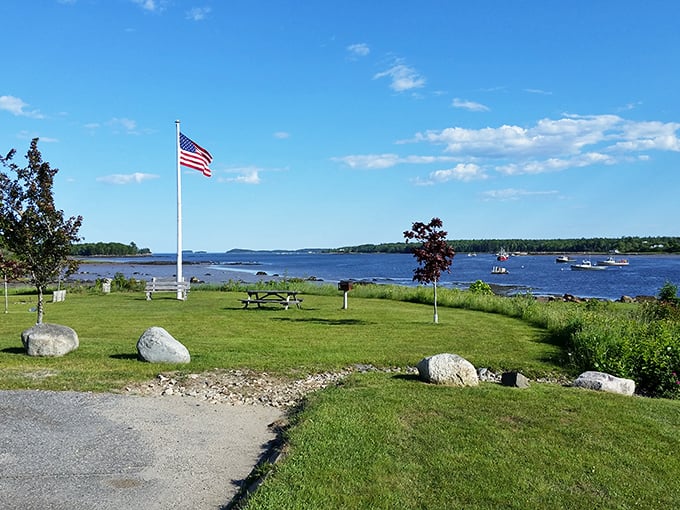 The American flag waves proudly over Milbridge's waterfront park, where retirement dollars buy both beauty and community.