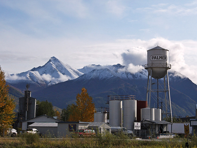 Palmer's iconic water tower stands sentinel against the majestic Chugach Mountains, like a small-town lighthouse guiding you home.