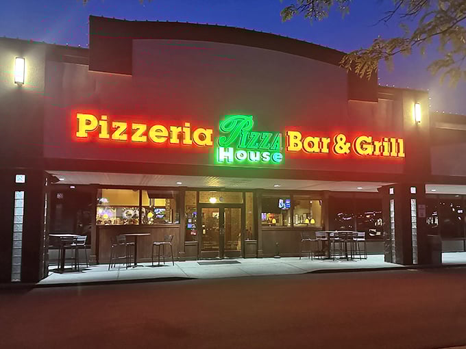 Pizza House glows like a beacon for hungry college students and locals alike. The neon promises are always kept.
