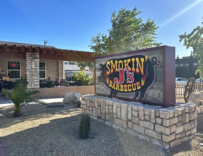 Smokin' J's rustic stone exterior stands like a barbecue oasis in the Nevada desert. Even the cactus lean in for a whiff!
