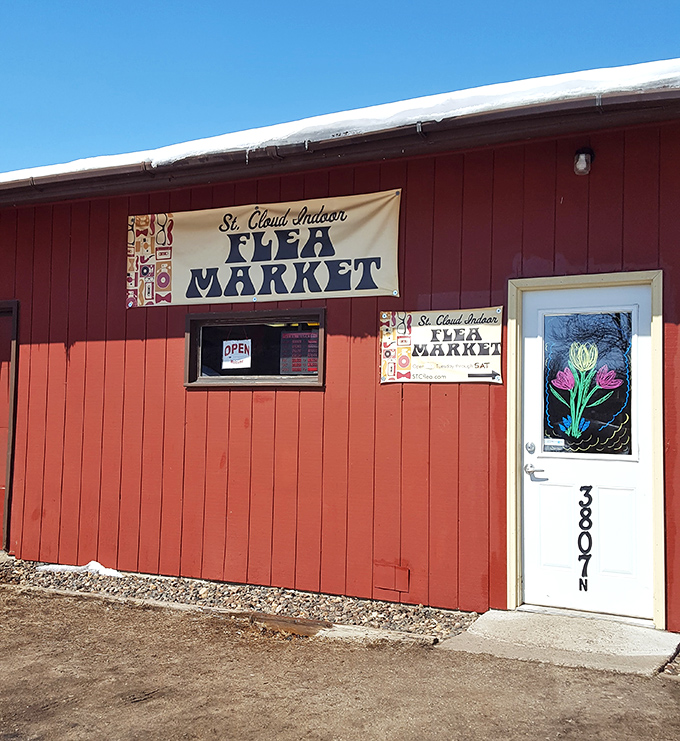 Red barn, endless treasures! The St. Cloud Flea Market's humble exterior hides a labyrinth of collectibles waiting for eagle-eyed shoppers to discover.