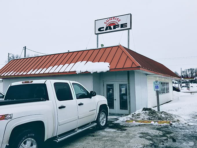 Sunrise Cafe stands proudly against winter's chill, its red roof a promise of warmth and homestyle cooking inside.