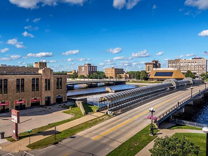 Downtown Waterloo shows off its riverside charm with historic brick buildings and that distinctive pedestrian bridge crossing the Cedar River.