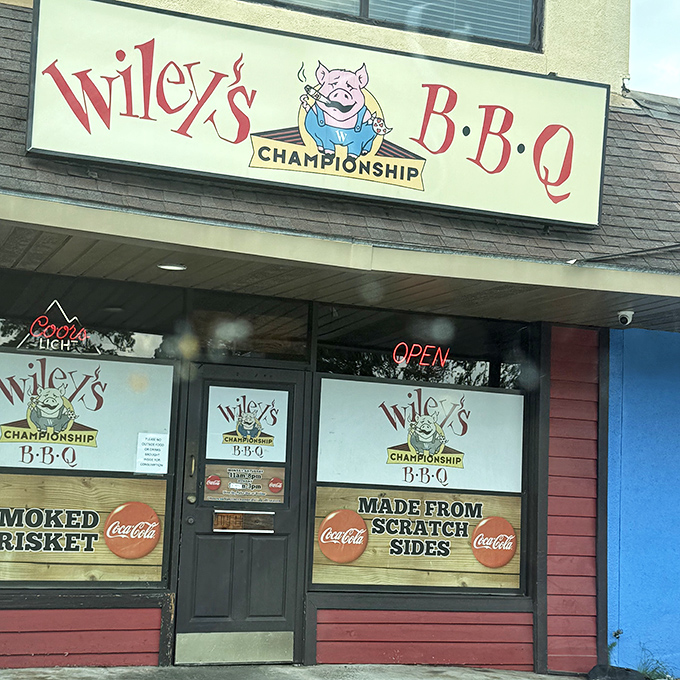 Wiley's Championship BBQ's metal-clad entrance beckons hungry visitors. Those string lights aren't just decoration&mdash;they're guiding stars for barbecue pilgrims!
