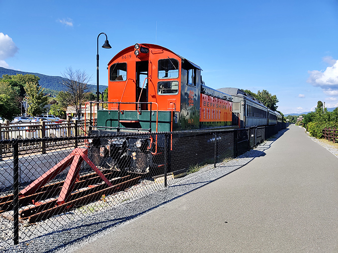 All aboard for nostalgia! Adam's vintage train stands as a bright orange reminder of the town's transportation history.