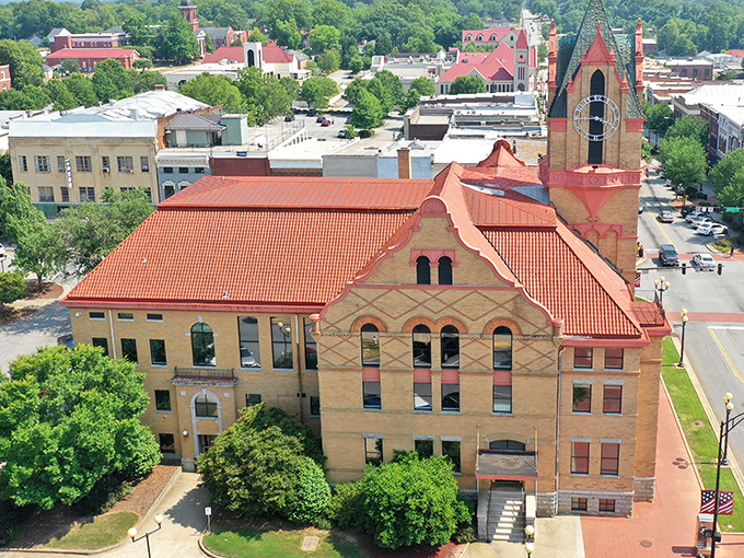 The Anderson County Courthouse stands proud with its distinctive red roof and classic architecture&mdash;Southern dignity in brick form.