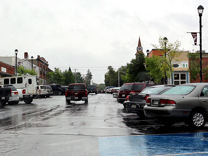 Rain-slicked streets reflect Caribou's no-nonsense downtown. Where practical meets affordable in Maine's northern frontier.