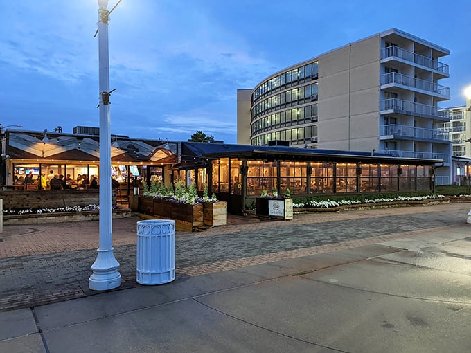 As evening falls, Chix on the Beach transforms from sunny seafood spot to twinkling oceanfront oasis.