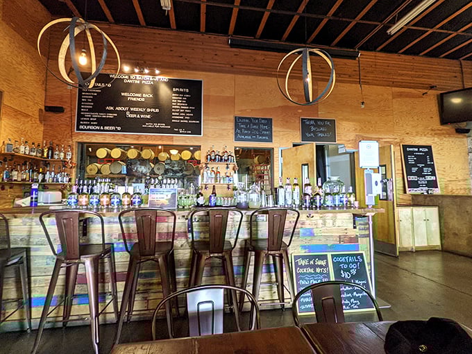 Inside Dantini, the warm wooden bar invites you to pull up a stool and watch pizza artistry unfold before your very eyes.